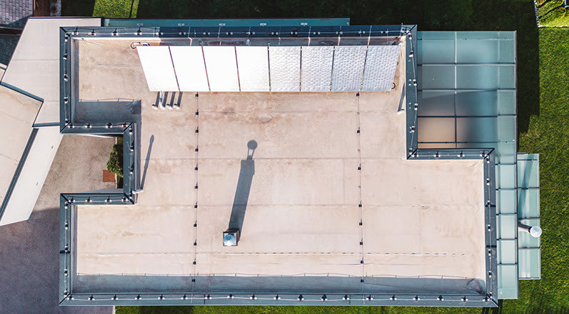 Should Flat Roofs Be Sloped? Angle, Pitch, Drainage & More