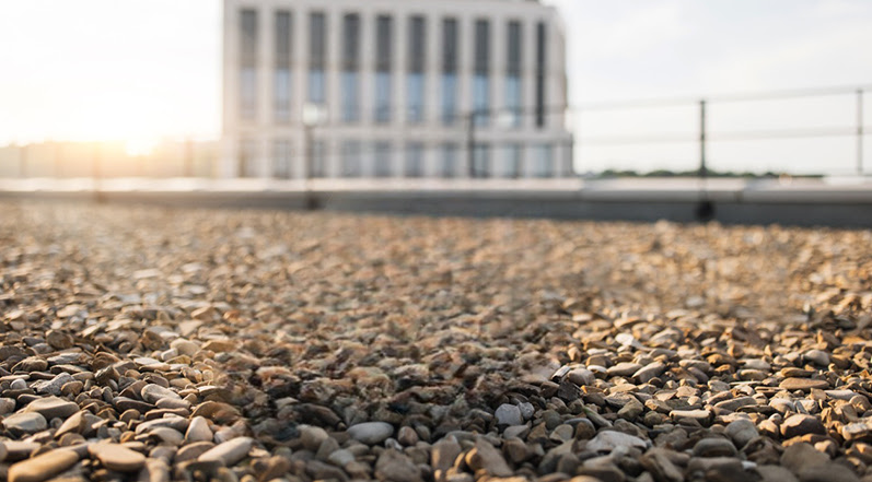 What Are Gravel and Stone Ballasts For on Commercial Roofs?